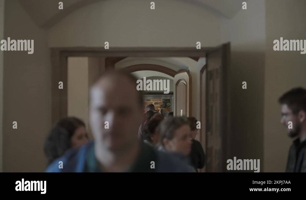 Crowd of people moves through halls of famous museum in different ...