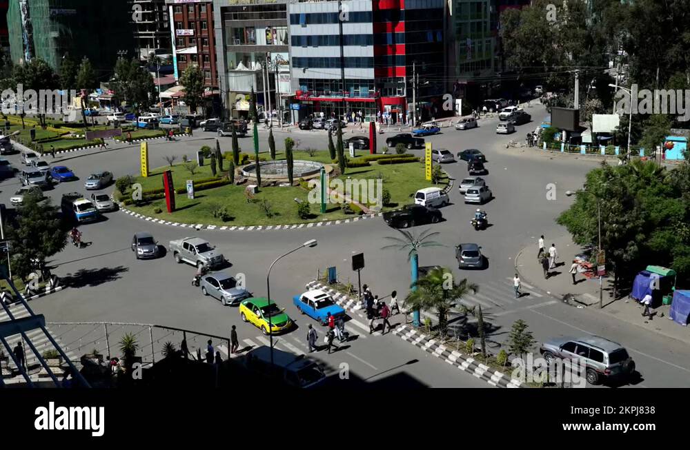 Car and pedestrian traffic on roundabout in Addis Ababa city, Ethiopia ...