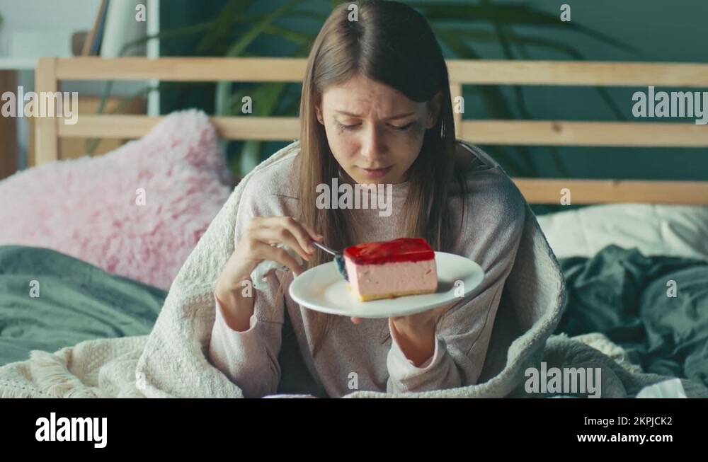 Heartbroken Girl Sitting on Sofa, Crying, Eating Cake, Using Tissues ...
