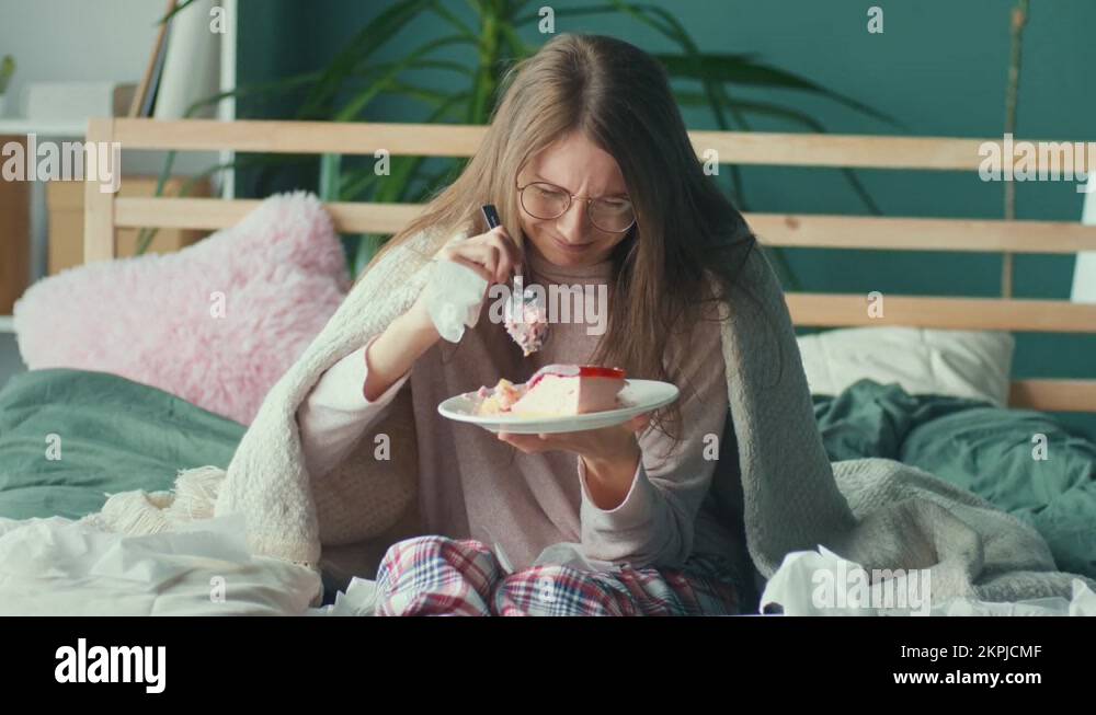 Heartbroken Girl Sitting on Sofa, Crying, Eating Cake, Using Tissues ...