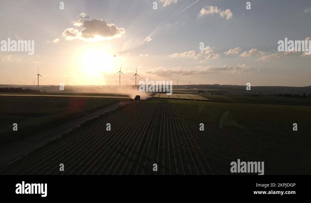 Drone passing over a moving tractor with Farm produce being transported ...