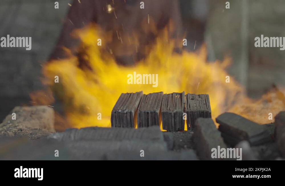 Hot Fire Being Fuelled By A Ironworker, Iron Forging Workshop In ...