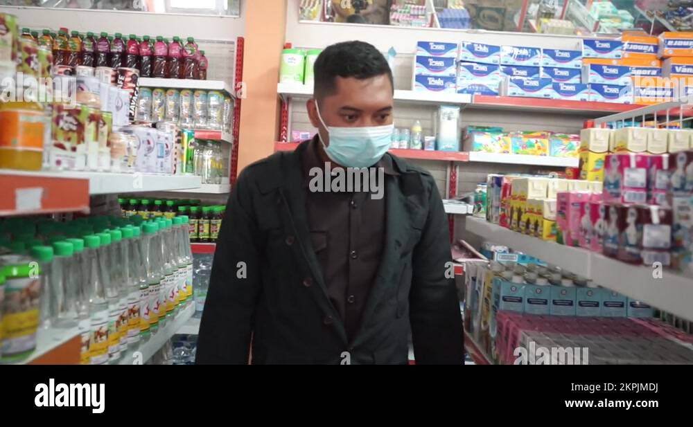 Male Customer Holding milk box Packet In Grocery Store or supermarket ...