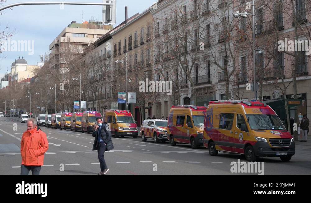 Medical emergency van units are stationed in the street as teams ...