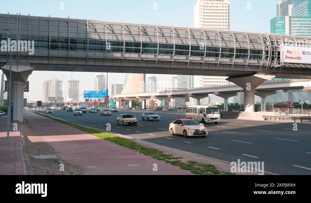 Cars on the famous Sheikh Zayed Road in Dubai, Metro overwalk bridge ...