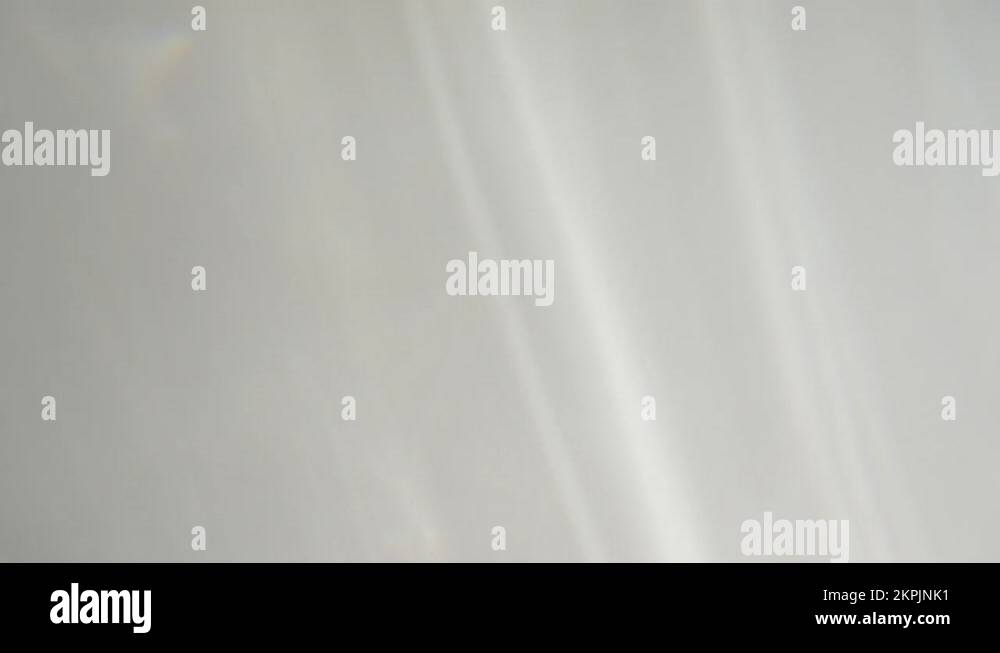 Sun light refractions effect with holographic colors flares on white wall Stock Video Footage ...