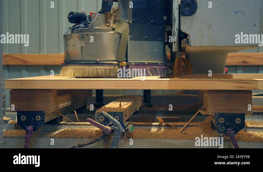 Massive automatic machine moves along the door billet Stock Video ...