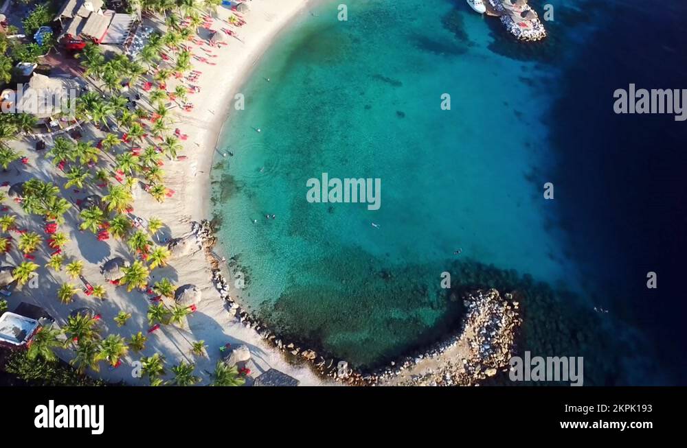 Overhead tilt up aerial view of Blu Bay beach in Curacao, Dutch ...