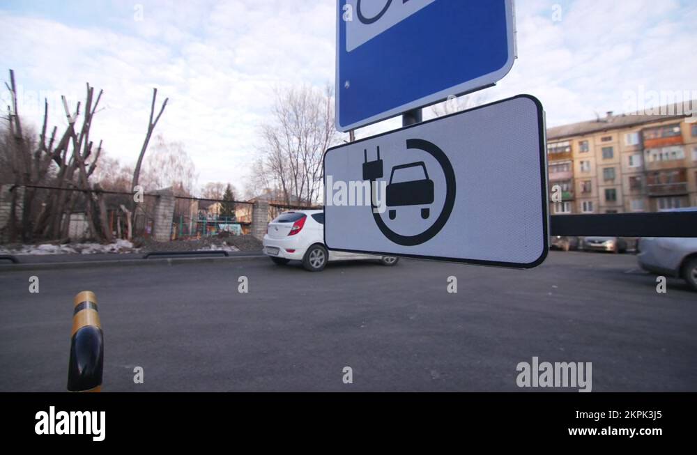 EV charging station sign on street and elevator for disabled Stock ...