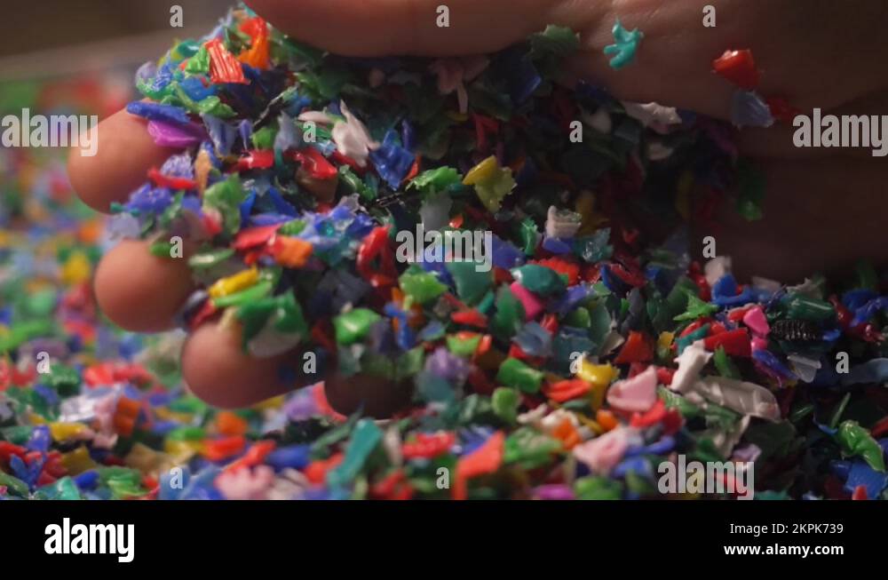microplastics in hands. colorful plastic fragments or particles, toxic ...