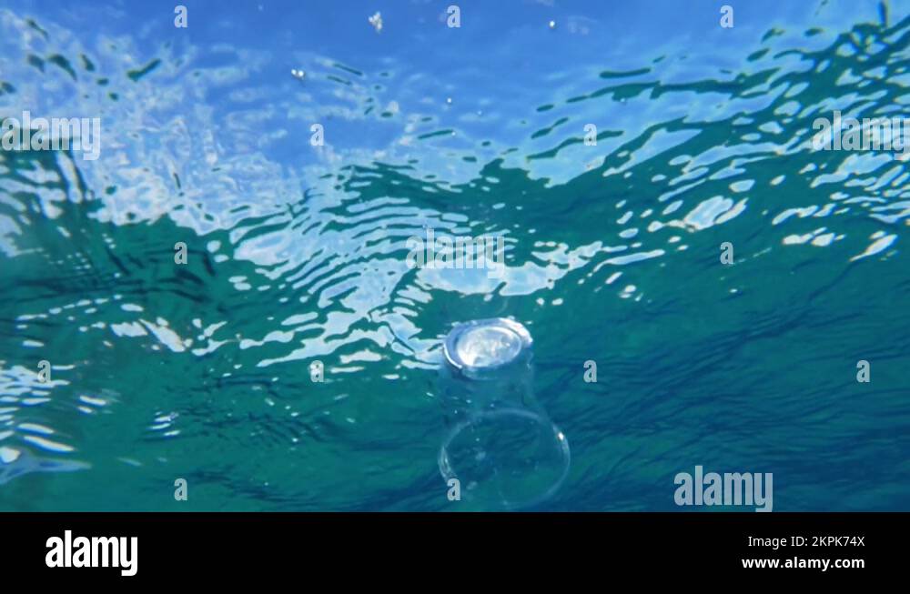 Plastic cup underwater, plastic pollution. Plastic trash in ocean ...