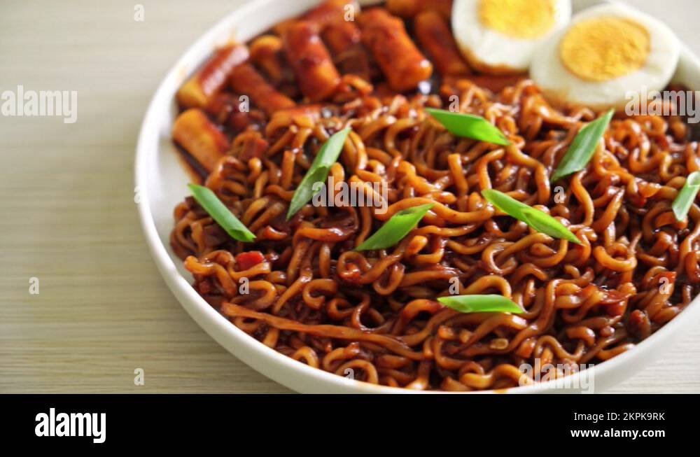Jjajang Rabokki - Korean instant noodles or Ramyeon with Korean rice cake Stock Video Footage ...