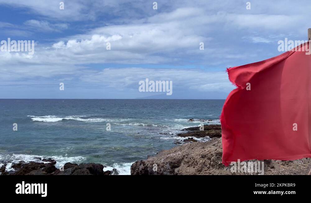 The red flag at the beach to remind people not to swim in the sea. 4K ...