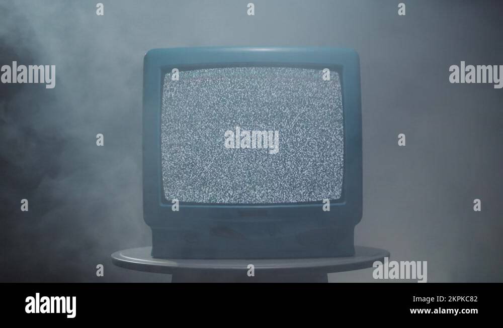Old vintage television on black background with smoke. Broken old ...