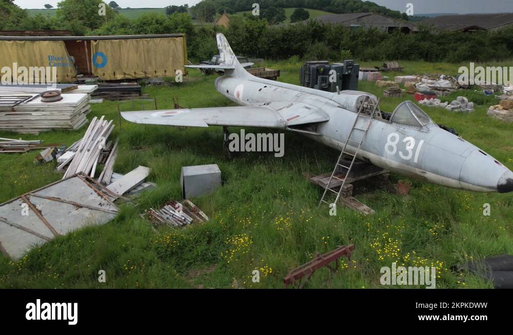 Scrap Hawker hunter air force fighter jet among junk in overgrown ...