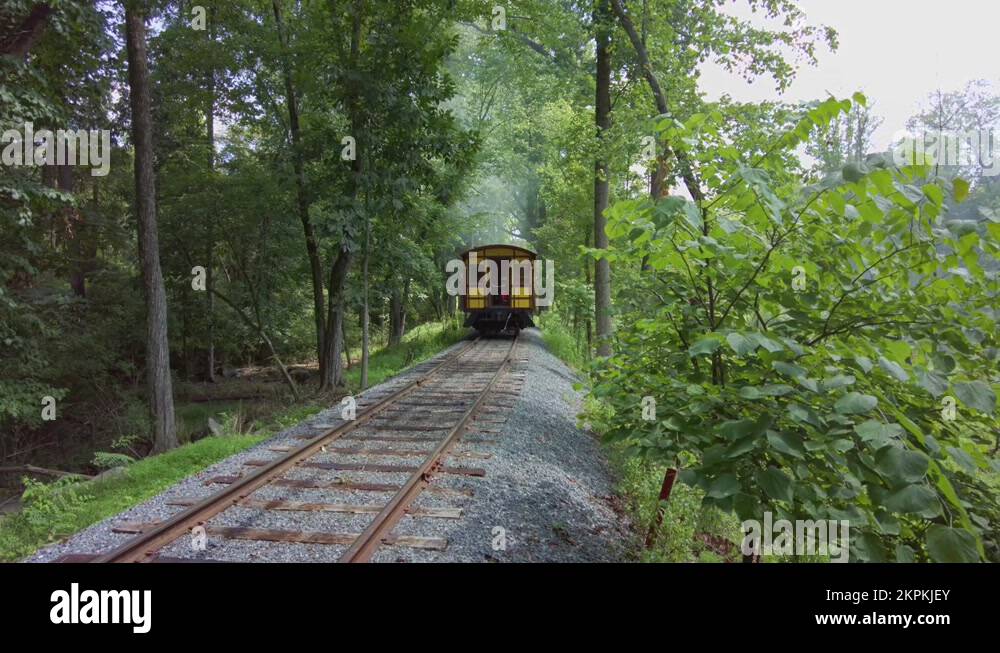 A View of An Antique Steam Engine, Leaving and Going Down the Single ...