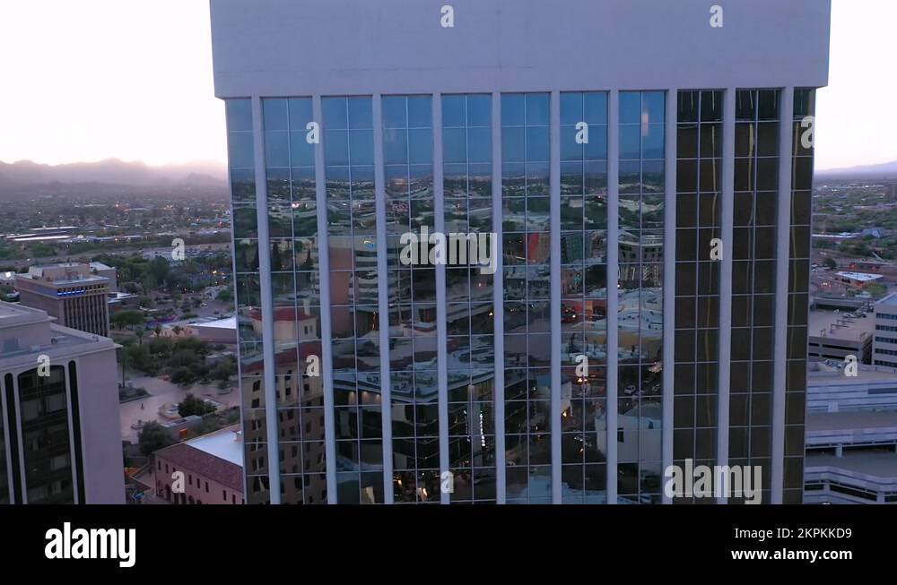 Tucson Arizona glass building high-rise. Drone descending. Reflections ...