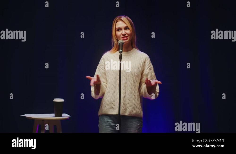 Stand-up cafe, woman comedy concert. Woman telling jokes on stage ...