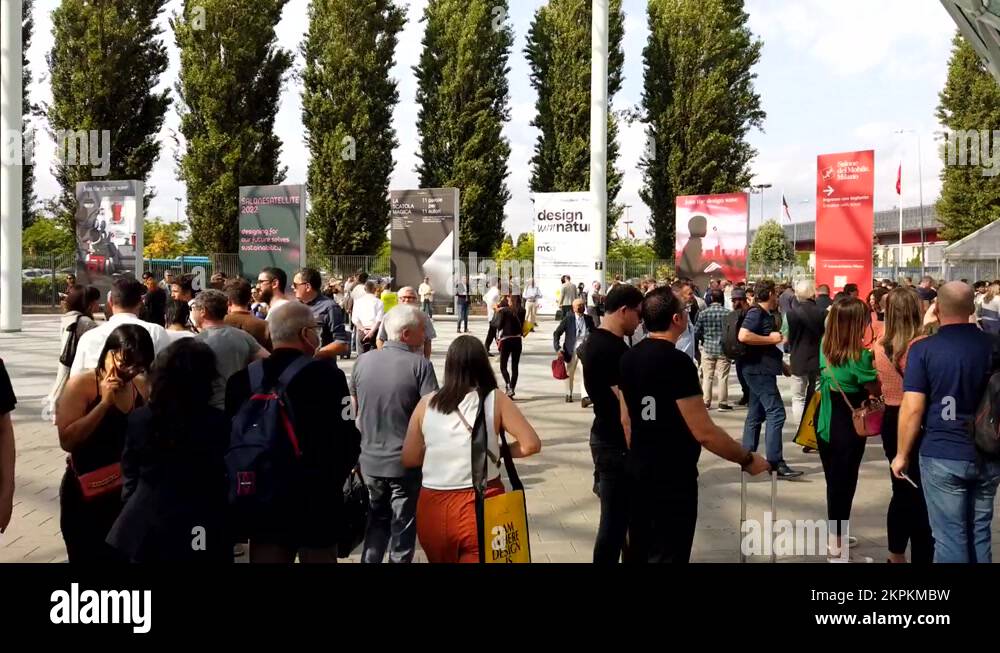 motion lapse of crowd waiting and entering salone del mobile main gate ...