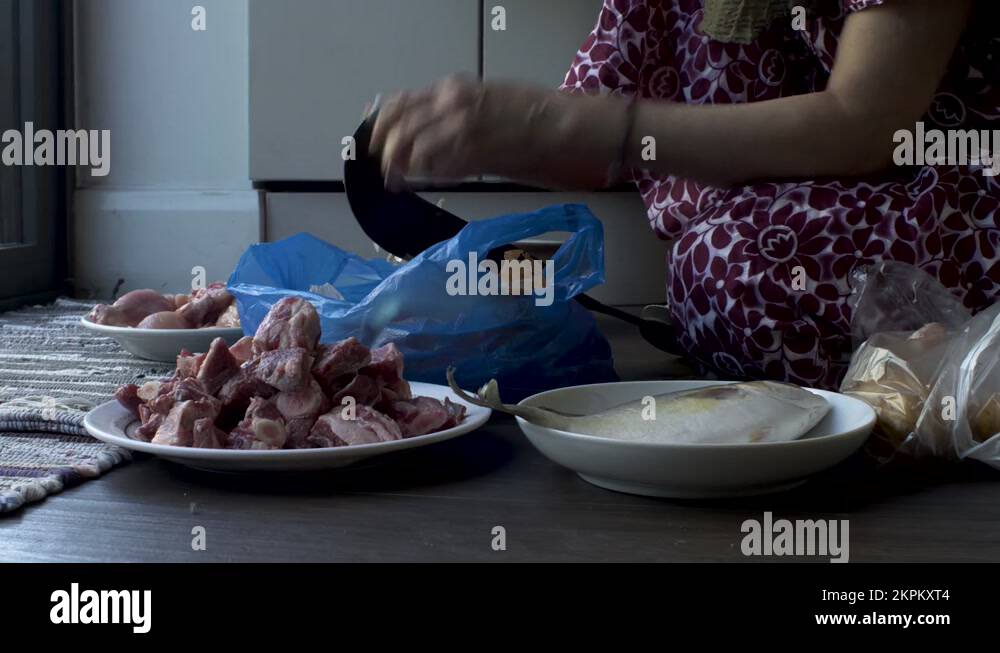 Close-up hands of women slicing potatoes Using Pahsul or Boti. Locked ...