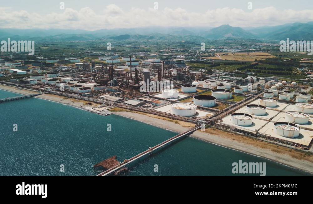 4k Aerial view of large oil refinery facilities and storage tank in ...