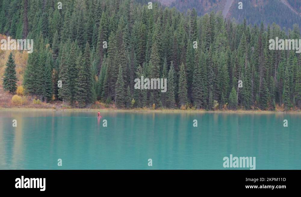 Canoe floating on the turquoise waters of Lake Louise in Banff National ...