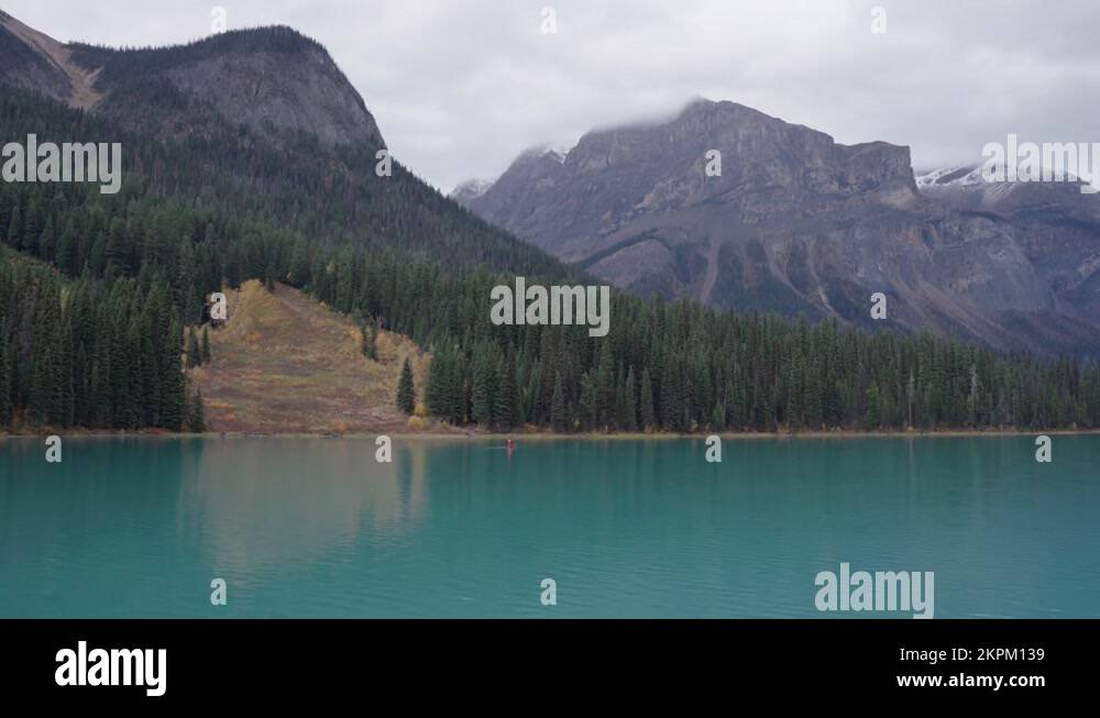 Canoe floating on the turquoise waters of Lake Louise in Banff National ...