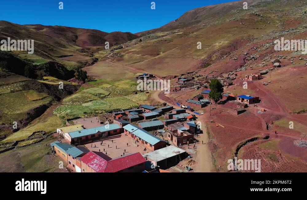 Traditional Inka farm and village with a view of the Andes Mountains in ...