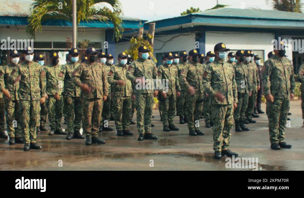 Philippine National Police officers attend a flag ceremony amidst a ...