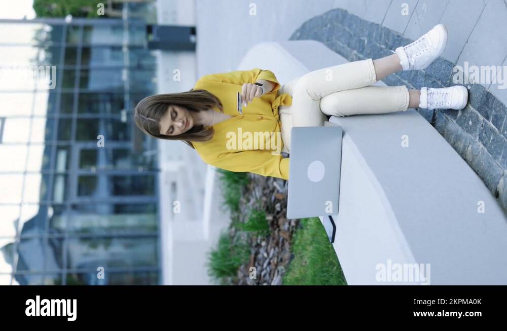 Vertical orientation video of female holding credit card making e bank ...