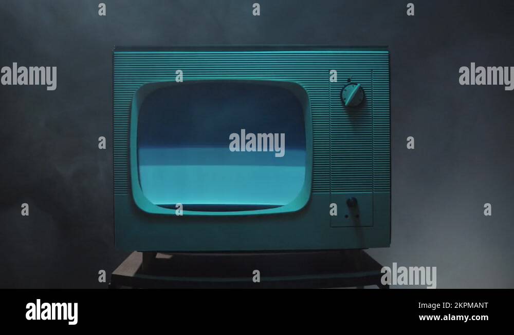 Old vintage television on black background with smoke. Broken old ...