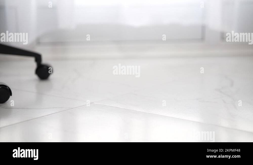 Close-up shot of office chair rolling on wheels Stock Video Footage - Alamy