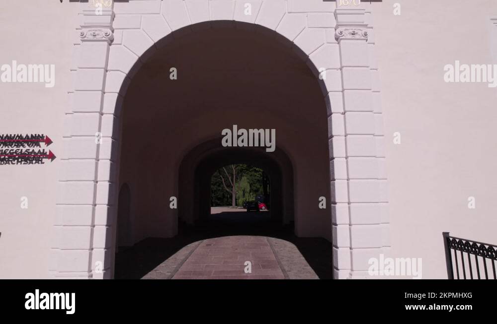 Slow zoom out from entrance to full view of Köthen castle entrance on ...