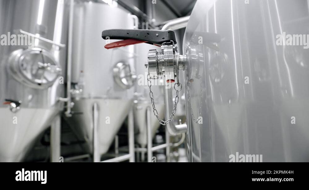 Stainless steel tanks for brewing beer. Huge stainless vats in a ...