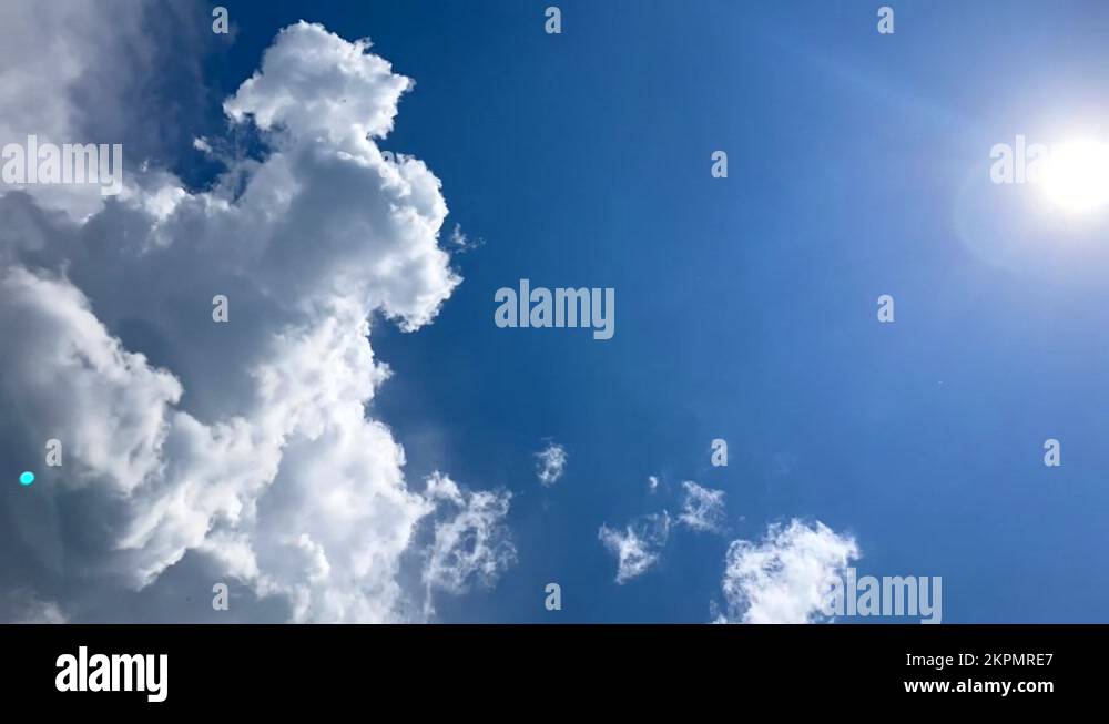Flying across soft blue sky with light fluffy white Stock Videos ...