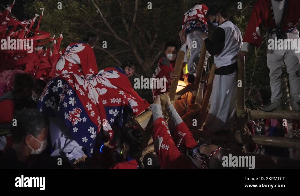 Japanese people climbing on top of Mikoshi during float battle, Sagicho ...