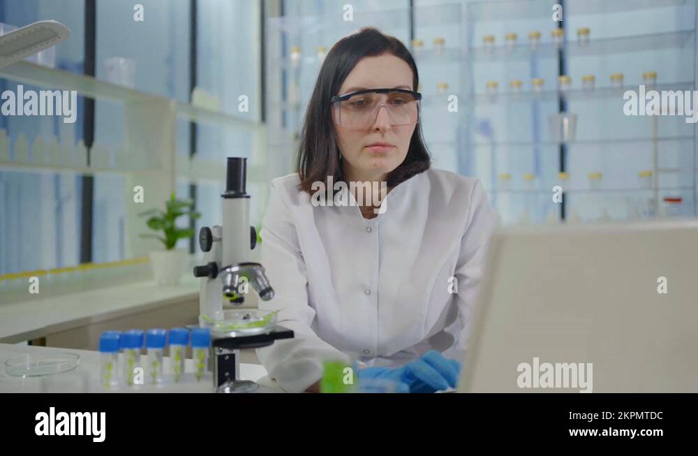 Female scientist looks through microscope Stock Videos & Footage - HD ...