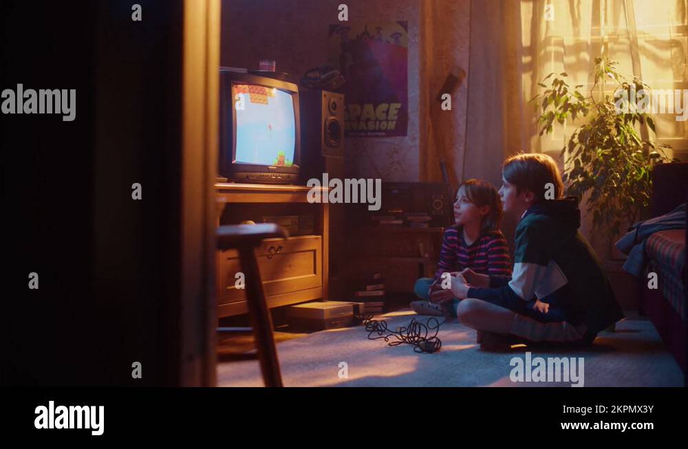 Two Kids Playing Nostalgic Arcade Game at Home Stock Video Footage - Alamy