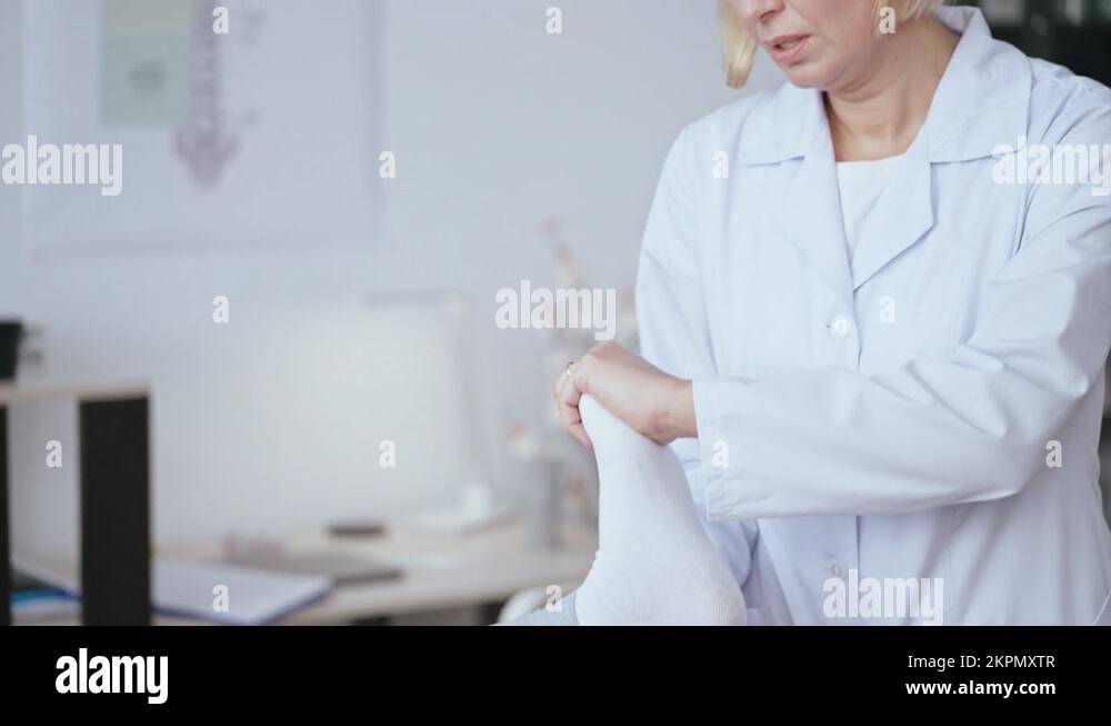 Doctor examining patient with foot injury, clinical examination ...