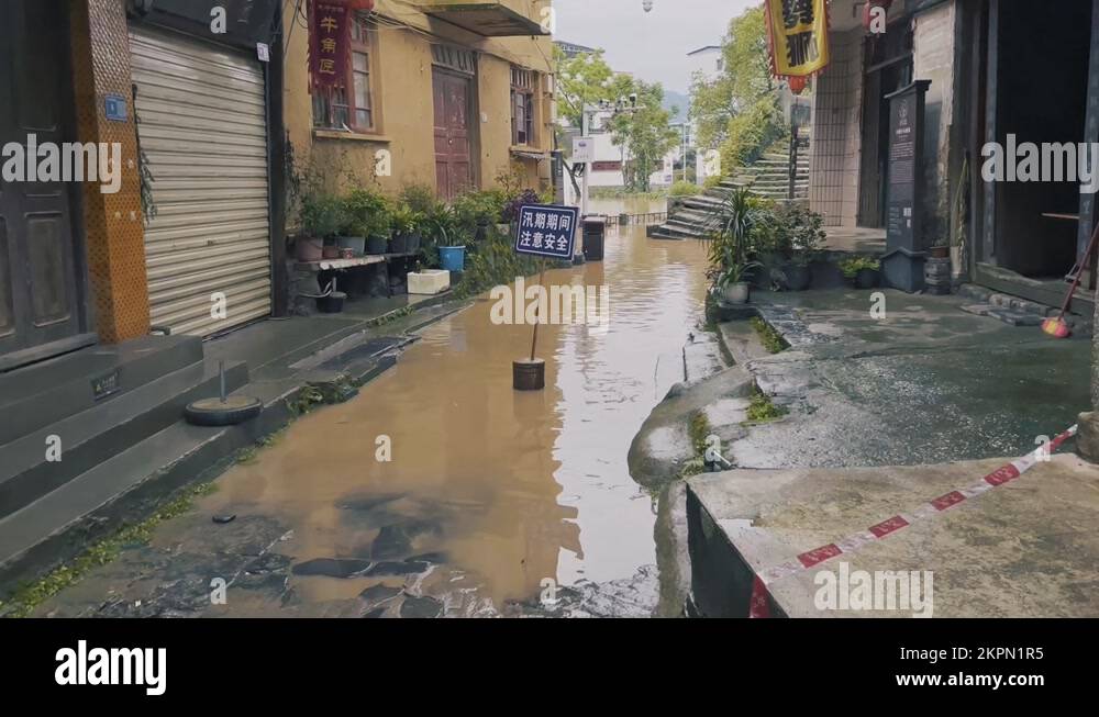 Caution Sign about Flood Water in Chinese "When water reaches this area ...