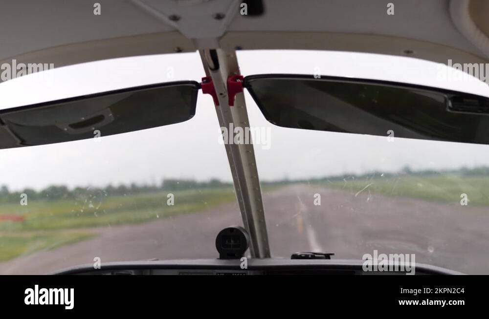 Biplane gaining speed on asphalt runway, cockpit interior view Stock ...