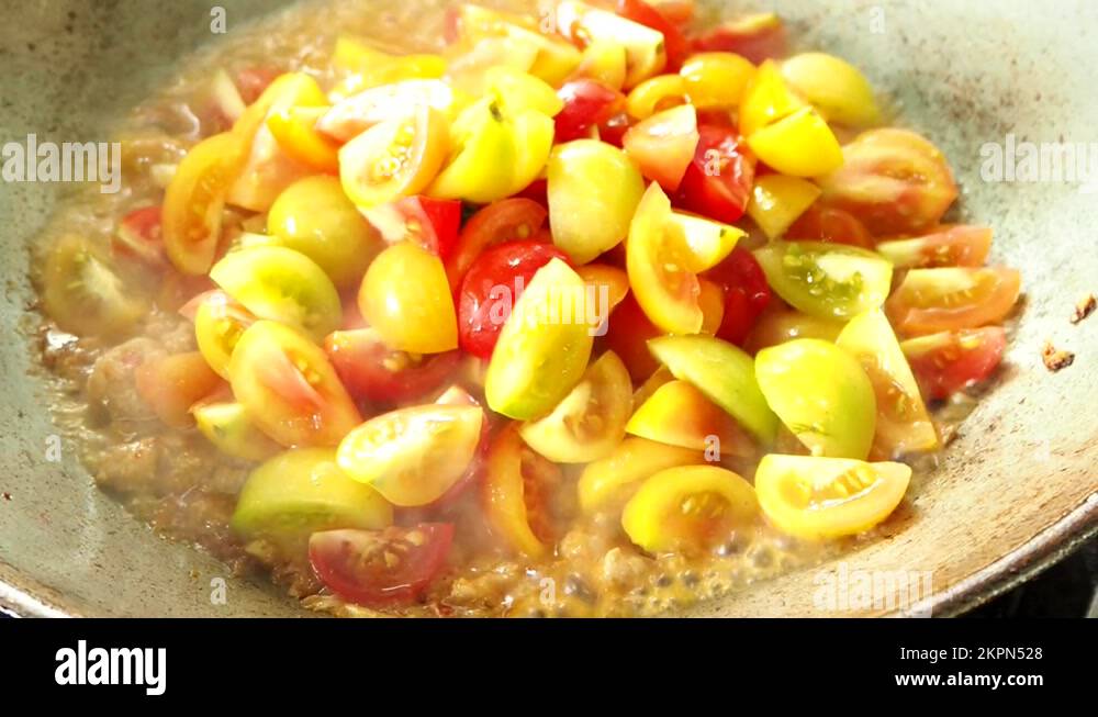 Cooking Nam Prik Ong (Spicy Northern Thai Pork and Tomato) in pan ...