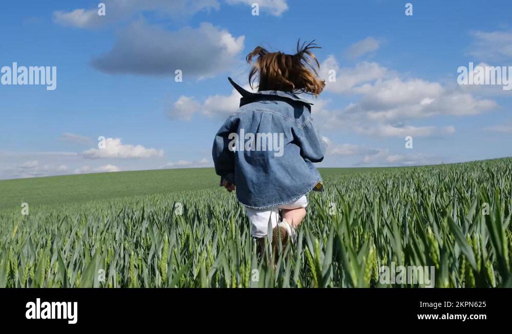 Happy teen girl in the countryside running across the field. Happy farmer girl Stock Video ...