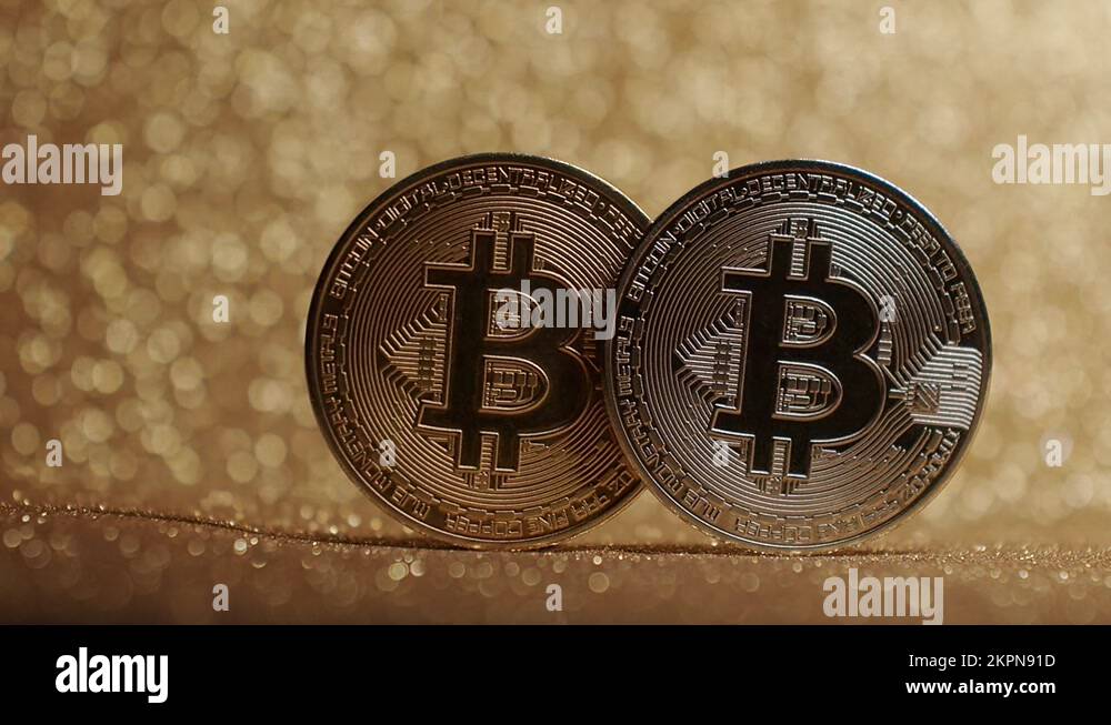 Bitcoin BTC coin. New virtual currency. Close Up on gold background ...