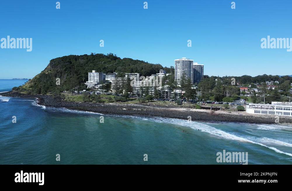 Surfers enjoy the world famous Burleigh Heads surf break with the ...