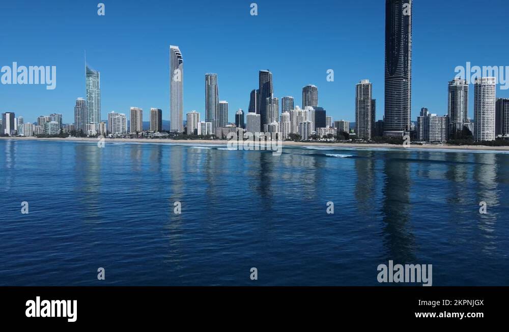 Slow moving drone view of the iconic Gold Coast skyline rising above ...