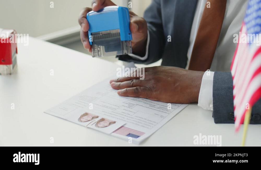 U.S. Visa Officer Putting Approved Stamp on Documents Stock Video ...