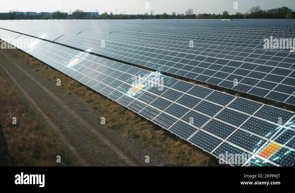 Fly over rows of photovoltaic panels on solar farm. Visual effect ...