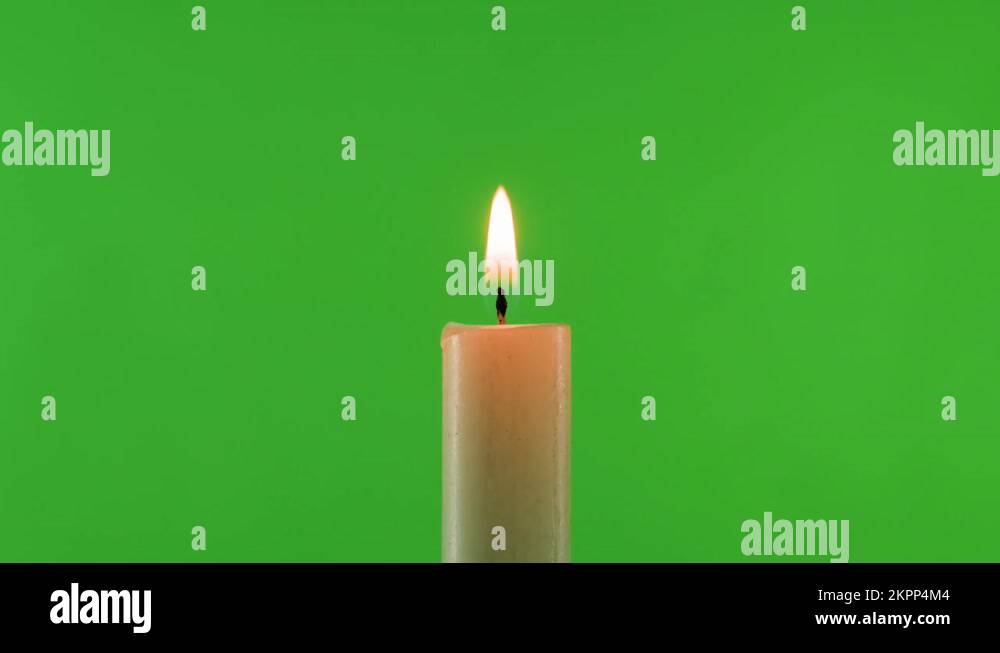 Burning wax candle on green chroma key background. Fire flame ...