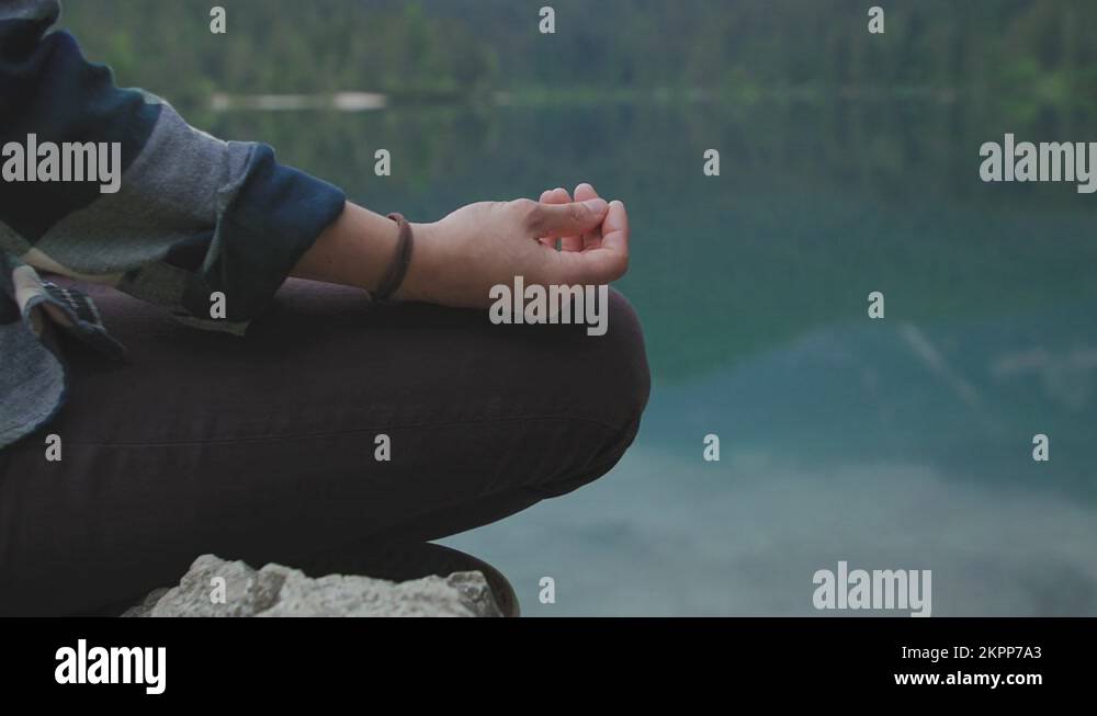 Foreground of a Woman doing Yoga in a Lotus Pose with a spectacular ...